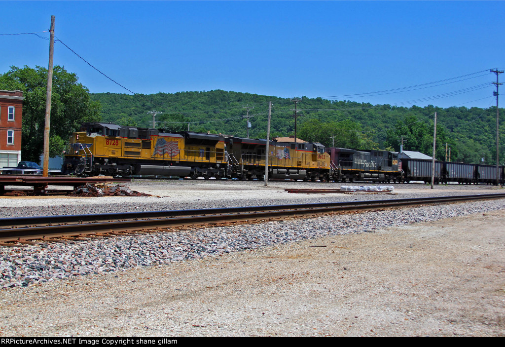 UP 8728 Hurries a Empty coal train WB.